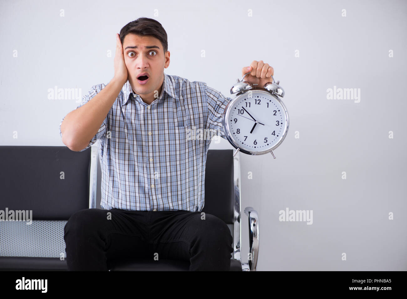 Man nervously impatiently waiting in the lobby Stock Photo - Alamy