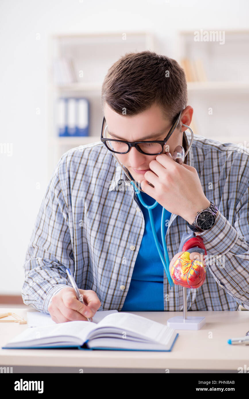 Medical student studying heart in classroom during lecture Stock Photo ...