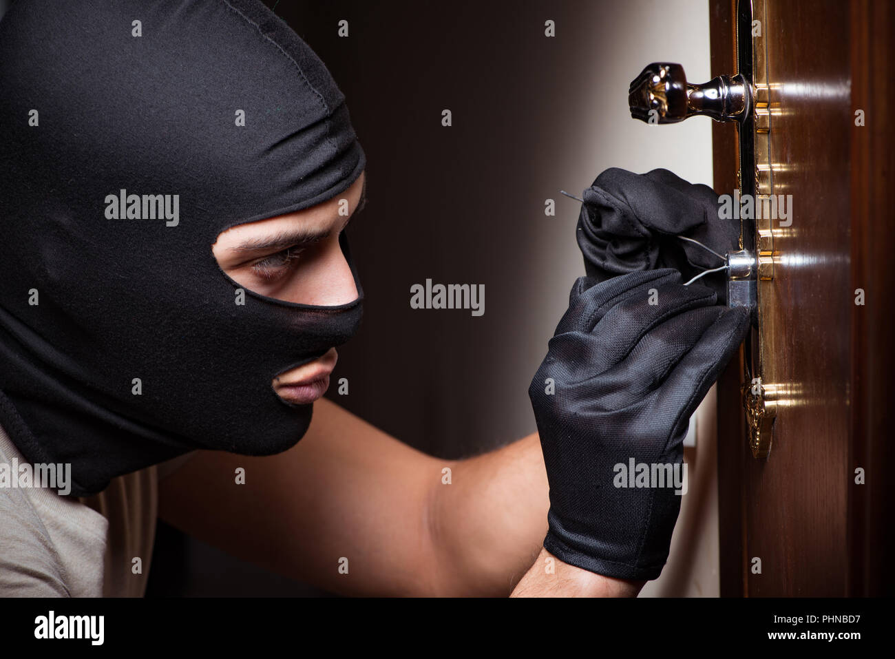 Burglar wearing balaclava mask at crime scene Stock Photo - Alamy