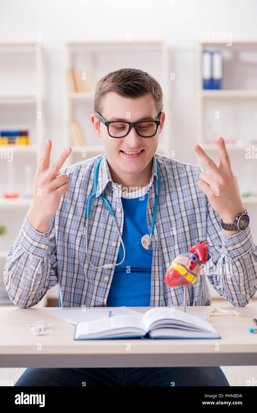 Medical student studying heart in classroom during lecture Stock Photo ...