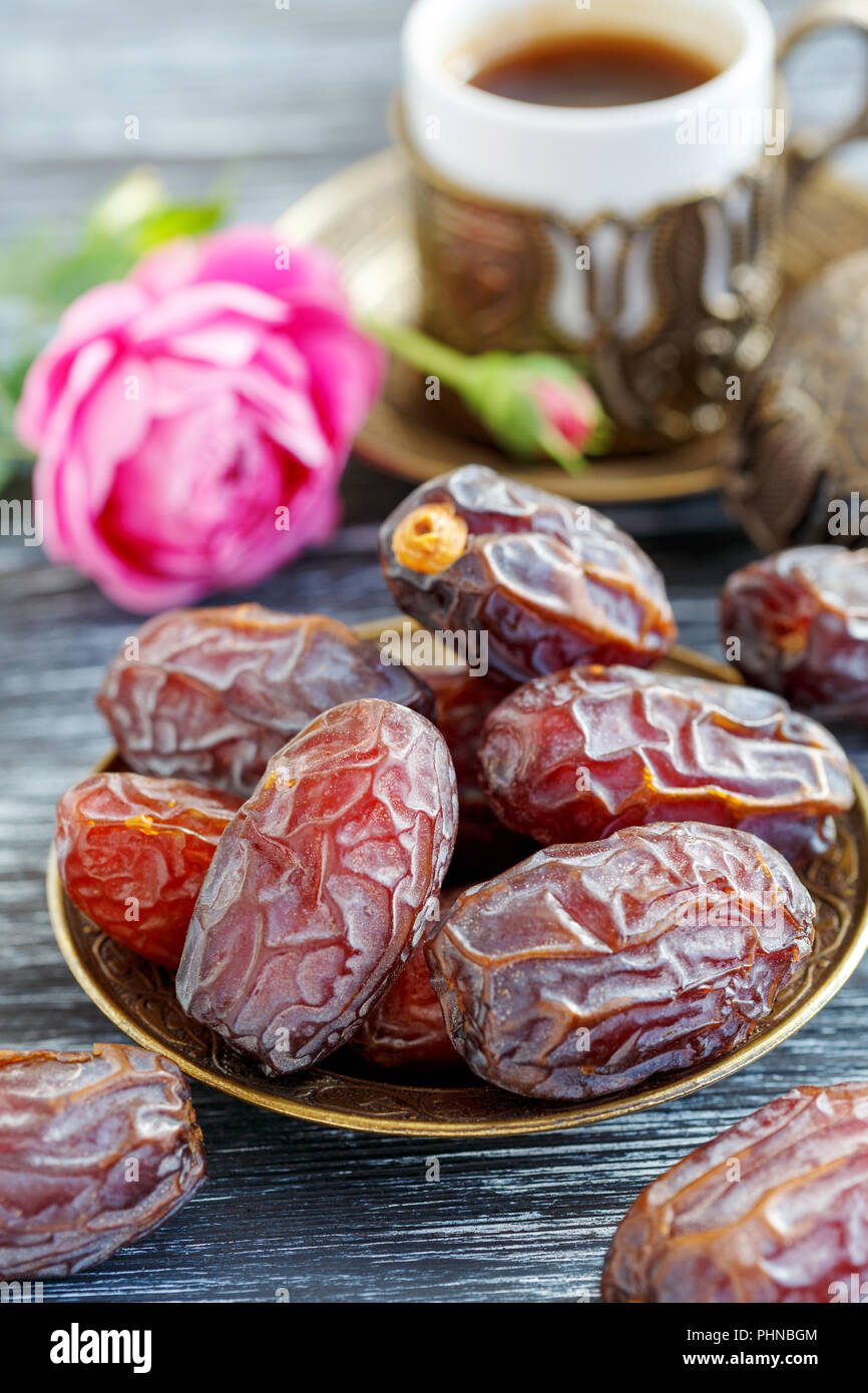 Delicious dates on a bronze plate Stock Photo - Alamy