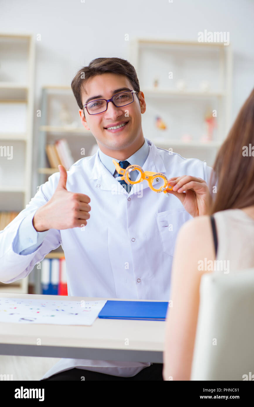 Ophthalmologist is checking up patient in eye doctor hospital Stock ...