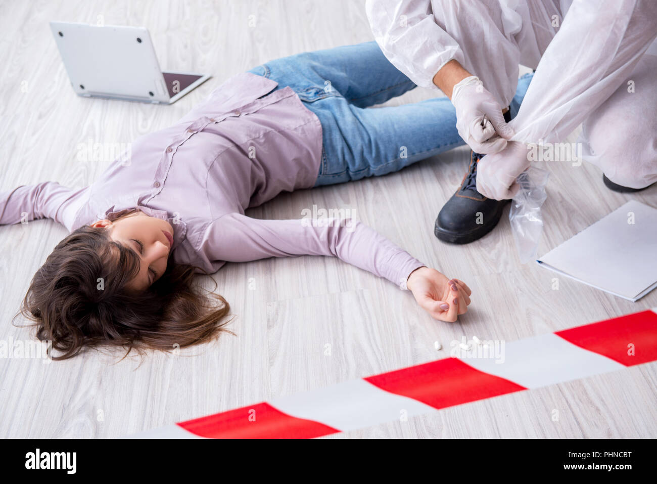 Forensic investigator at the crime scene investigating woman mur Stock ...