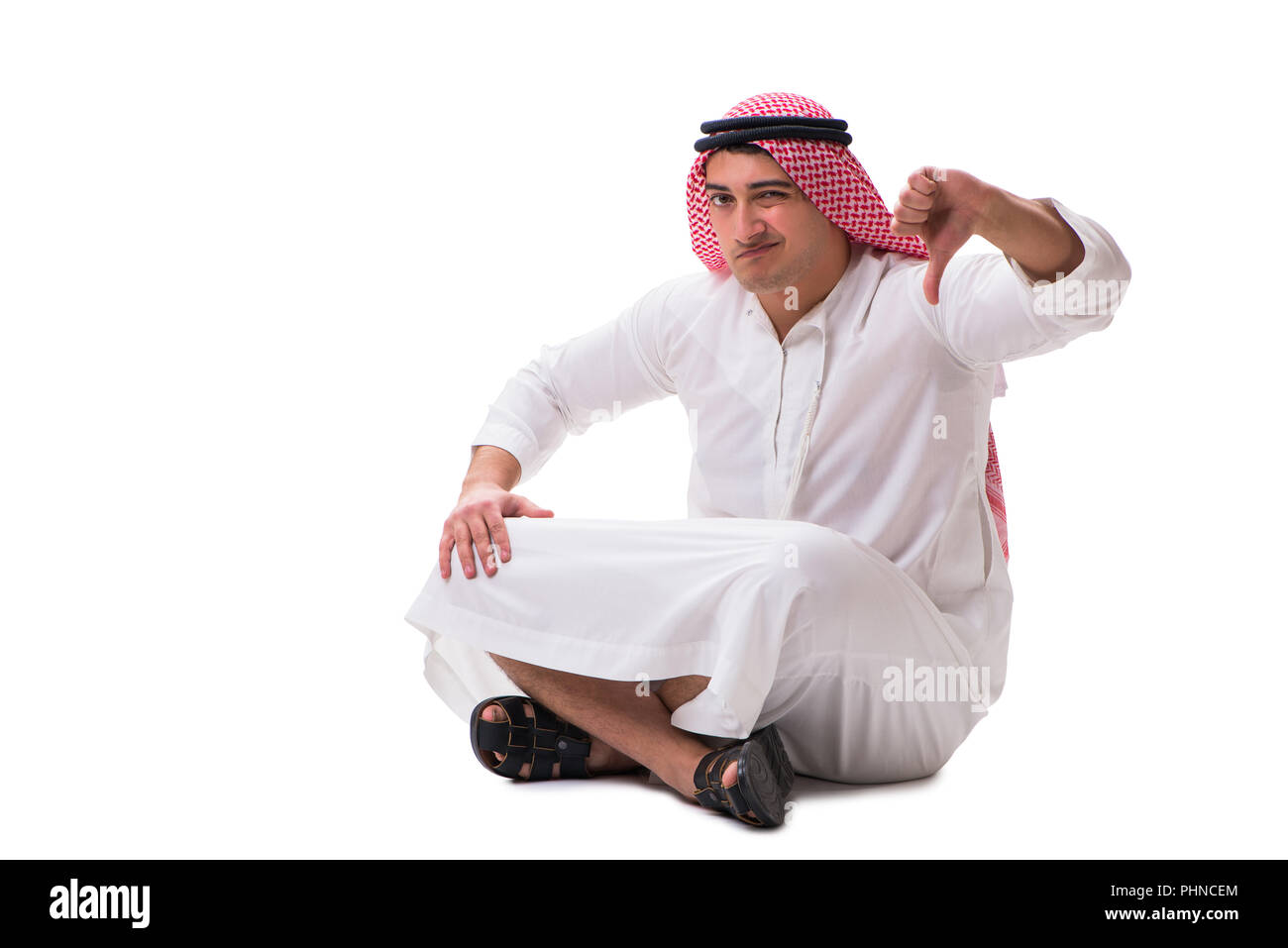 Young arab man sitting isolated on white Stock Photo - Alamy