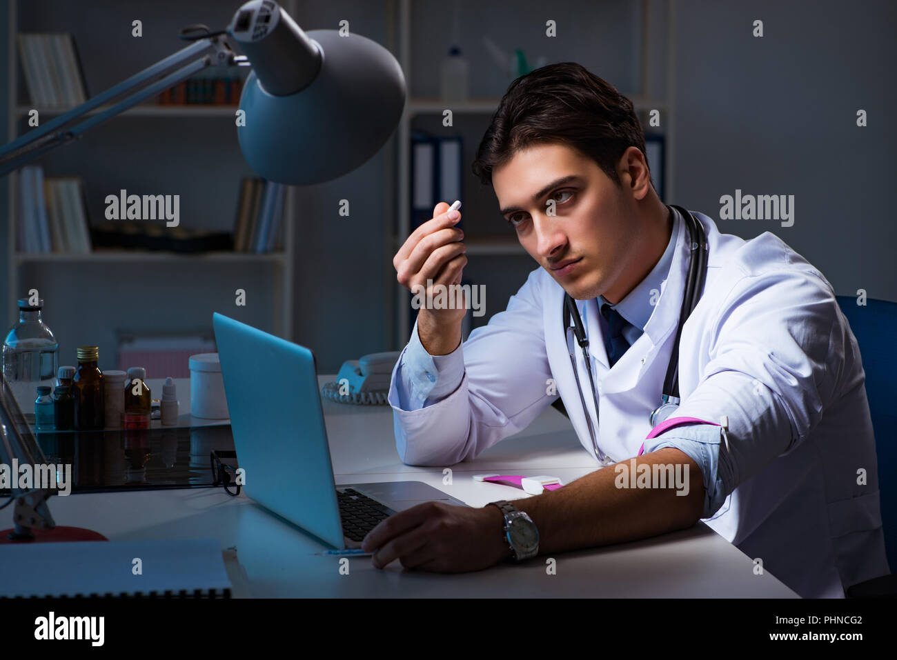 Doctor drug addict staying late on hospital Stock Photo - Alamy
