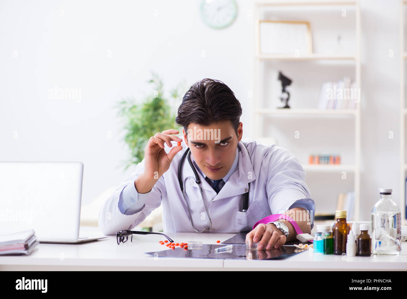 Doctor drug addict in the hospital Stock Photo - Alamy