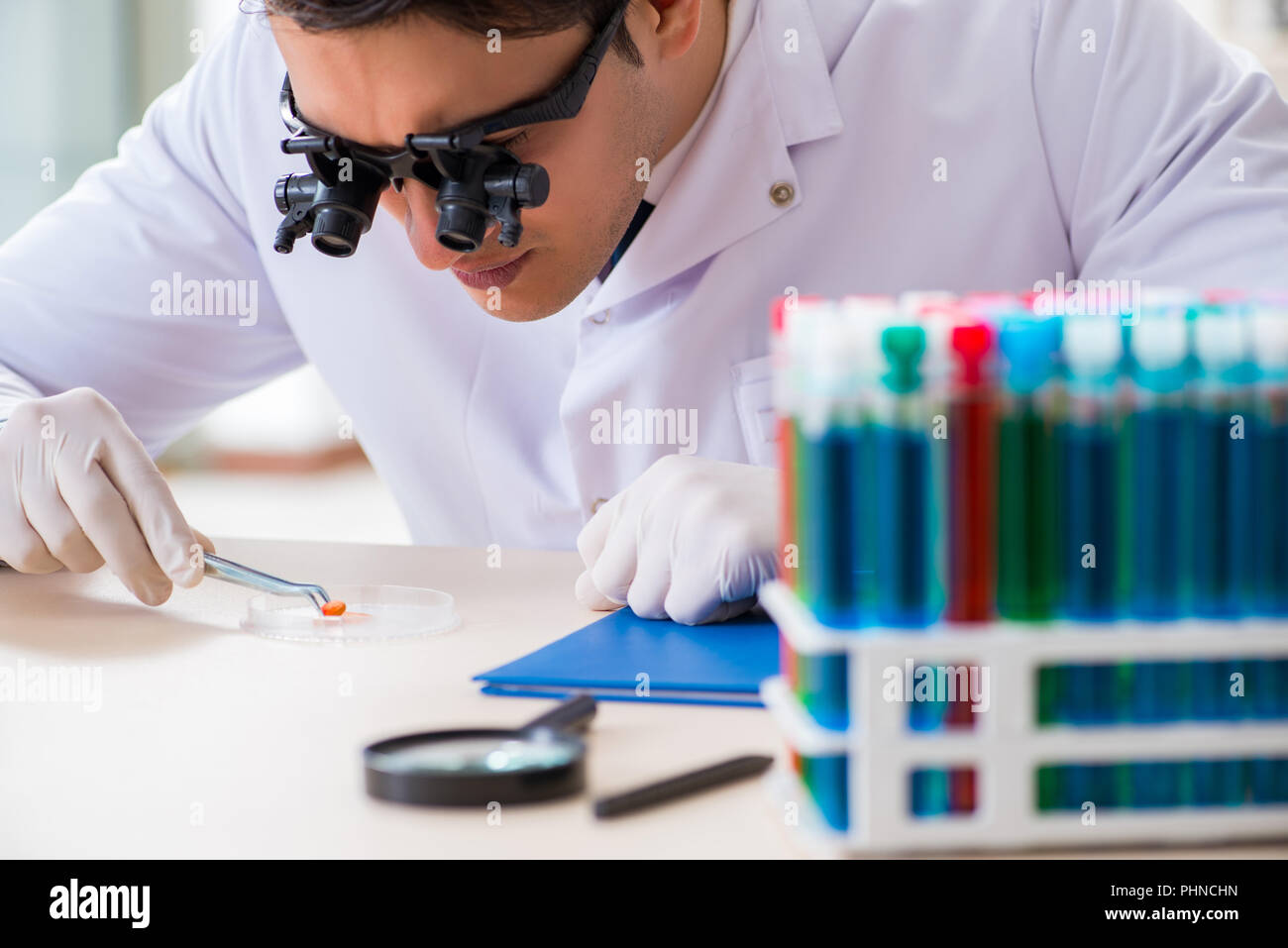 Drug synthesis concept with chemist working in research lab Stock Photo ...
