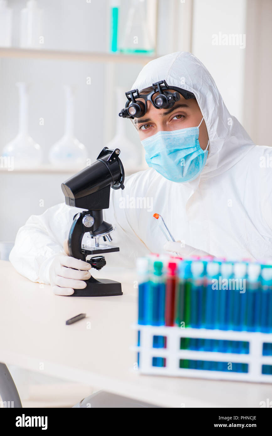 Drug synthesis concept with chemist working in research lab Stock Photo ...