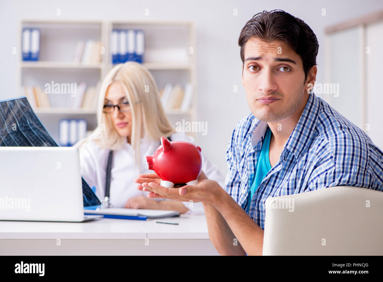 Male patient angry at expensive healthcare bill Stock Photo - Alamy