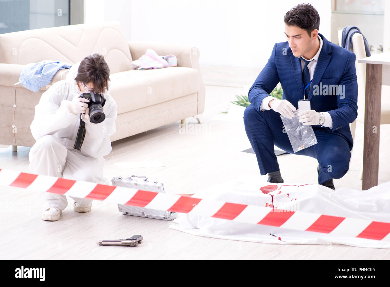 Forensics investigator at the scene of office crime Stock Photo - Alamy