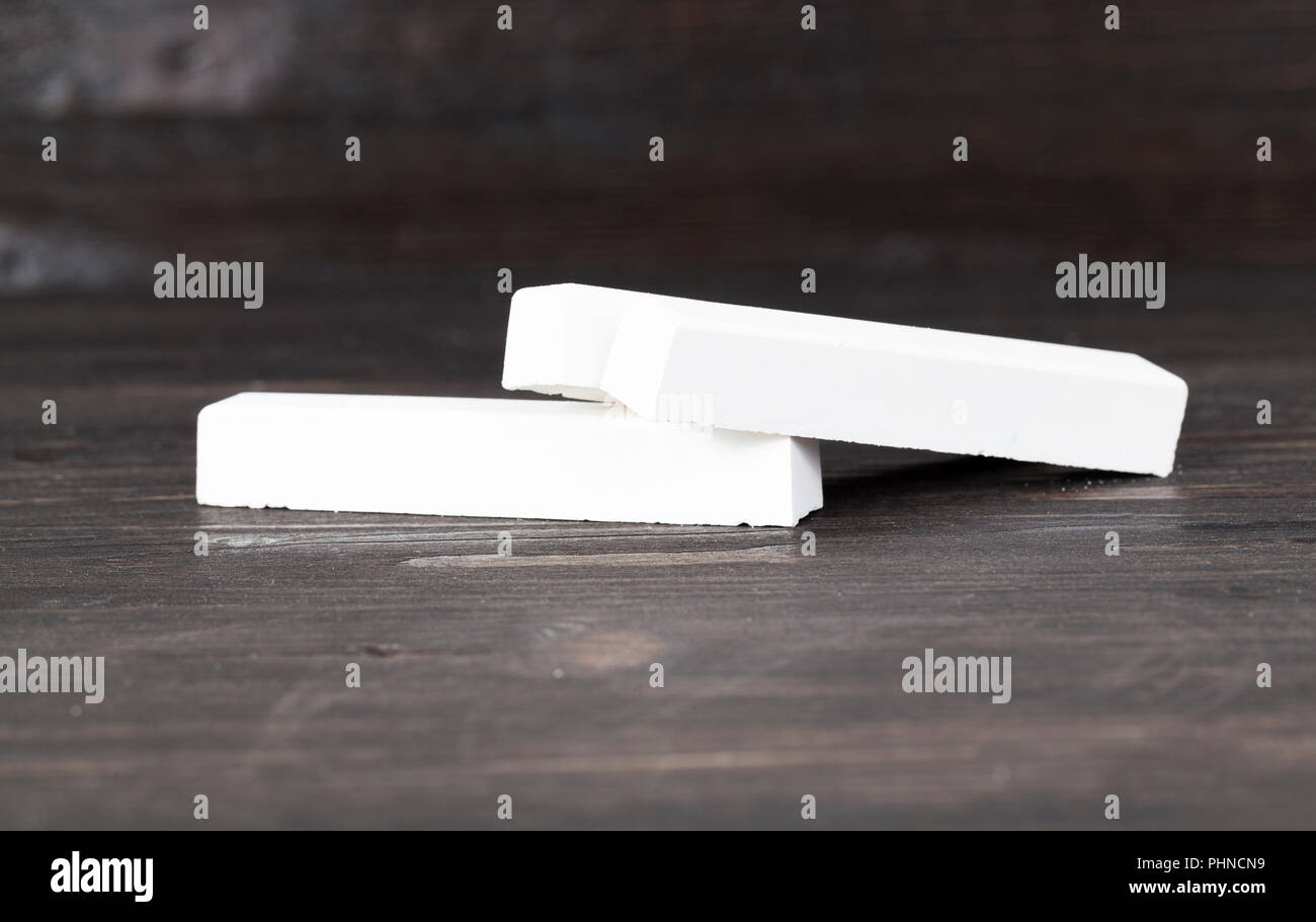 white square chalk lying on the board, used in school, closeup Stock ...