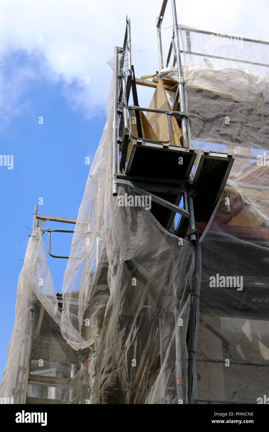 Scaffolding with protective nets Stock Photo - Alamy