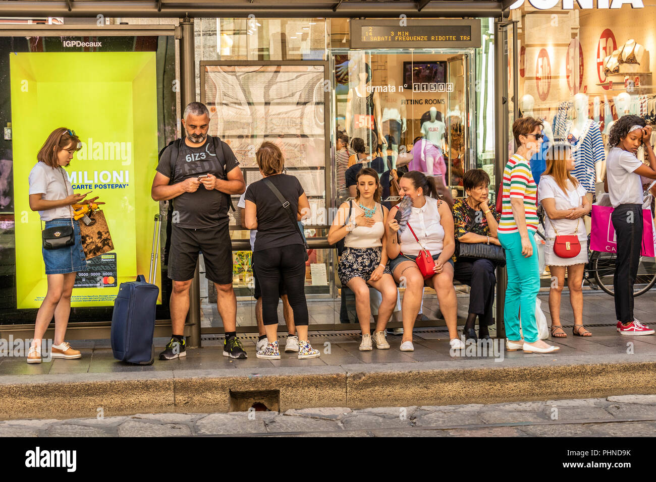 Street life night and day Milan Italy Stock Photo - Alamy