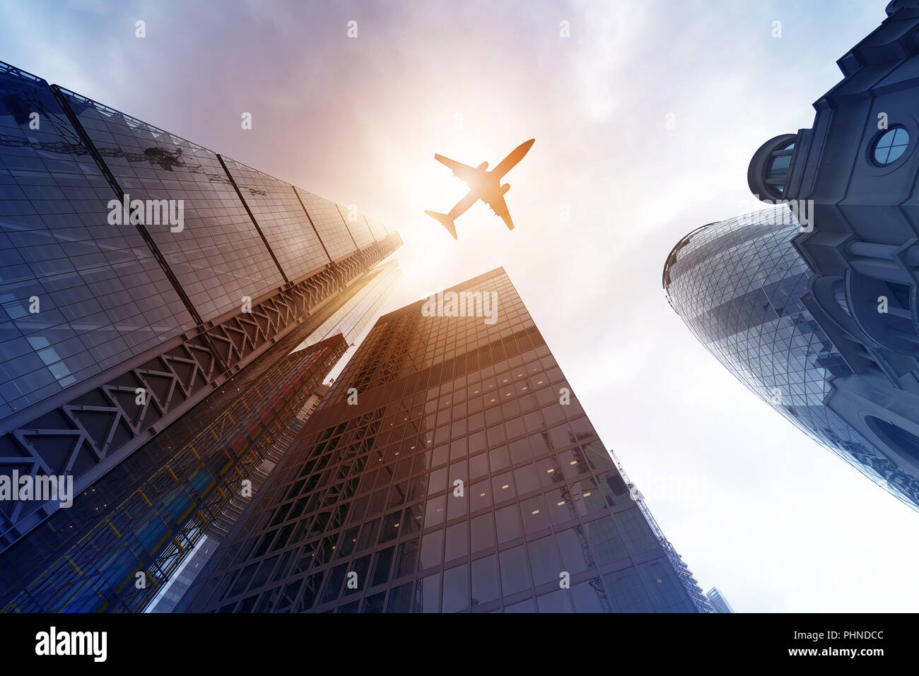 plane over highrise buildings Stock Photo - Alamy