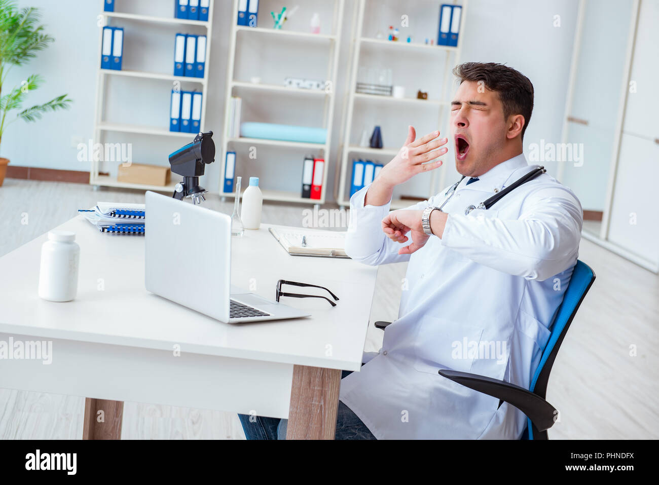 Tired doctor after night shift Stock Photo - Alamy