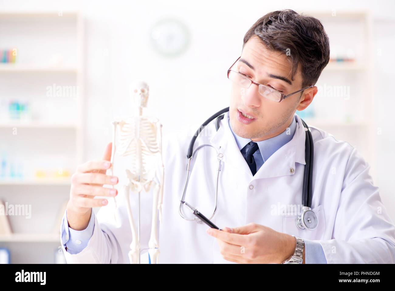 Doctor explaining human body on skeleton Stock Photo - Alamy