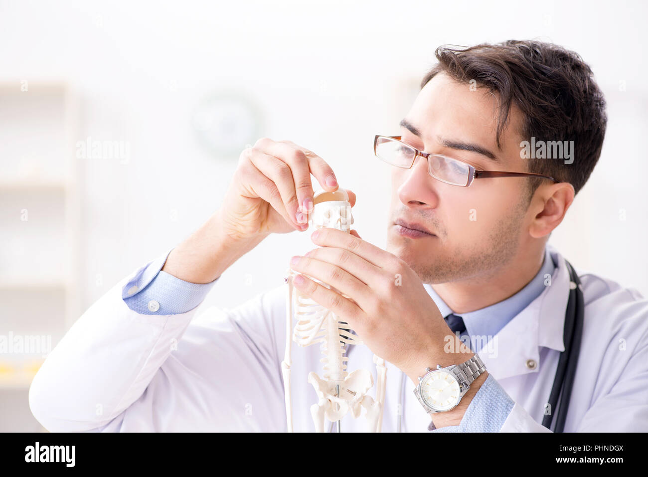 Doctor explaining human body on skeleton Stock Photo - Alamy