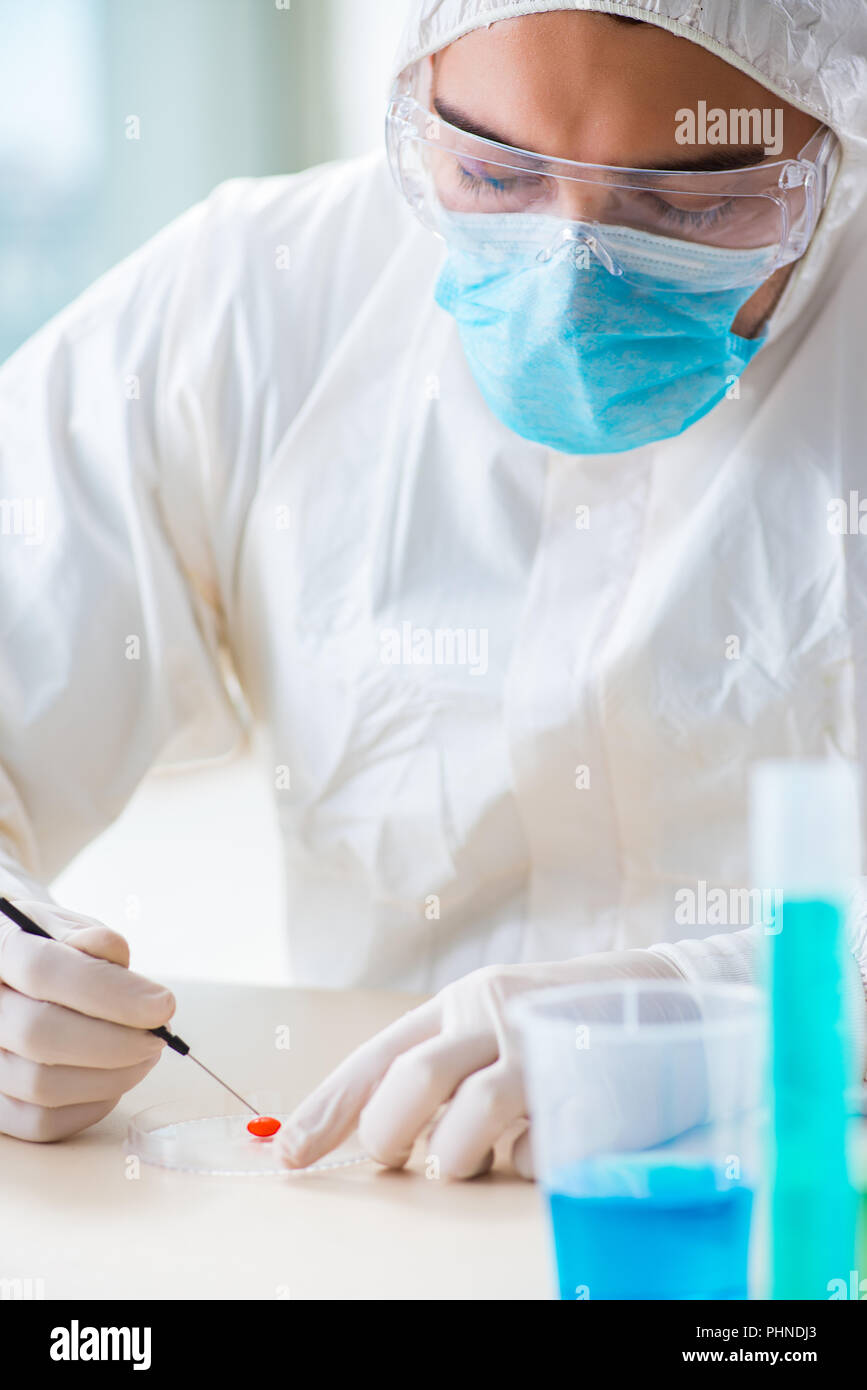 Lab assistant in drug synthesis concept Stock Photo - Alamy