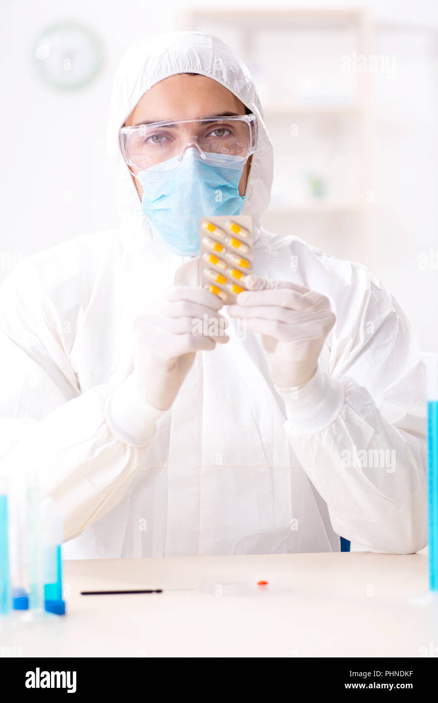 Lab assistant in drug synthesis concept Stock Photo - Alamy