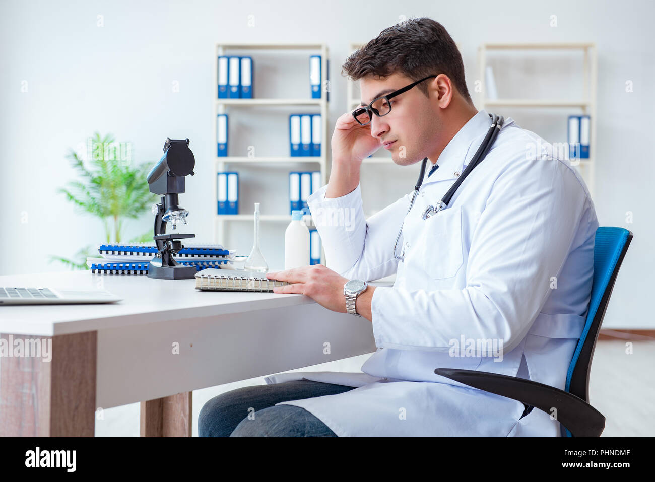 Tired doctor hi-res stock photography and images - Alamy