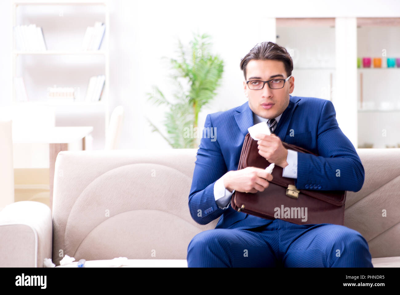 Sick employee staying at home suffering from flue Stock Photo - Alamy