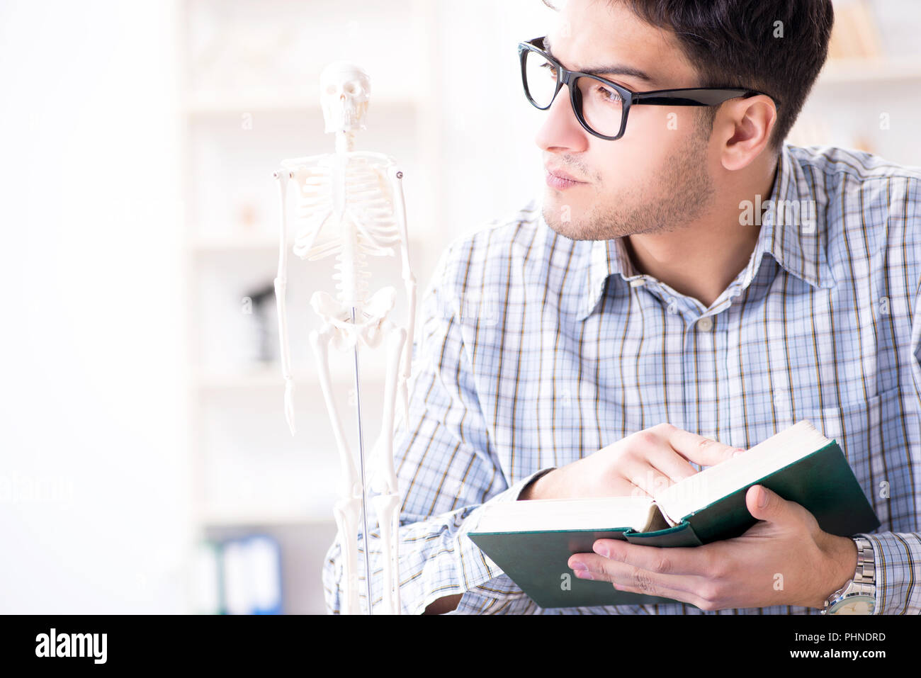 Medical student studing the skeleton Stock Photo - Alamy