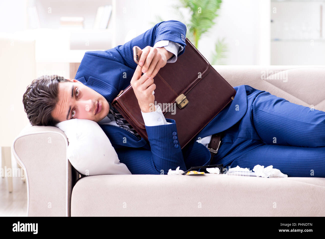 Sick employee staying at home suffering from flue Stock Photo - Alamy