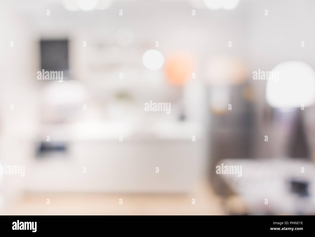 Blurred background modern kitchen and dinning room in house with bokeh ...