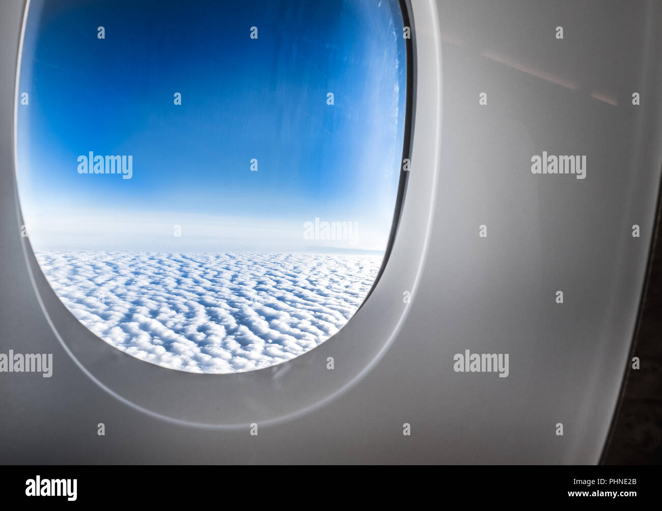 airplane window when flying see through at cloud and blue sky ...