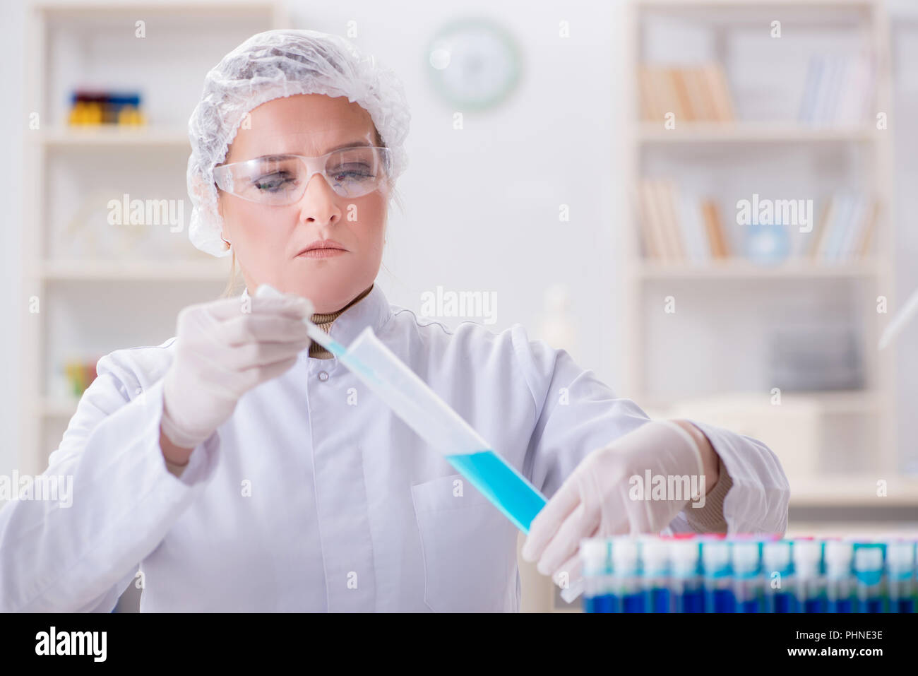 Woman chemist working in hospital clinic lab Stock Photo - Alamy