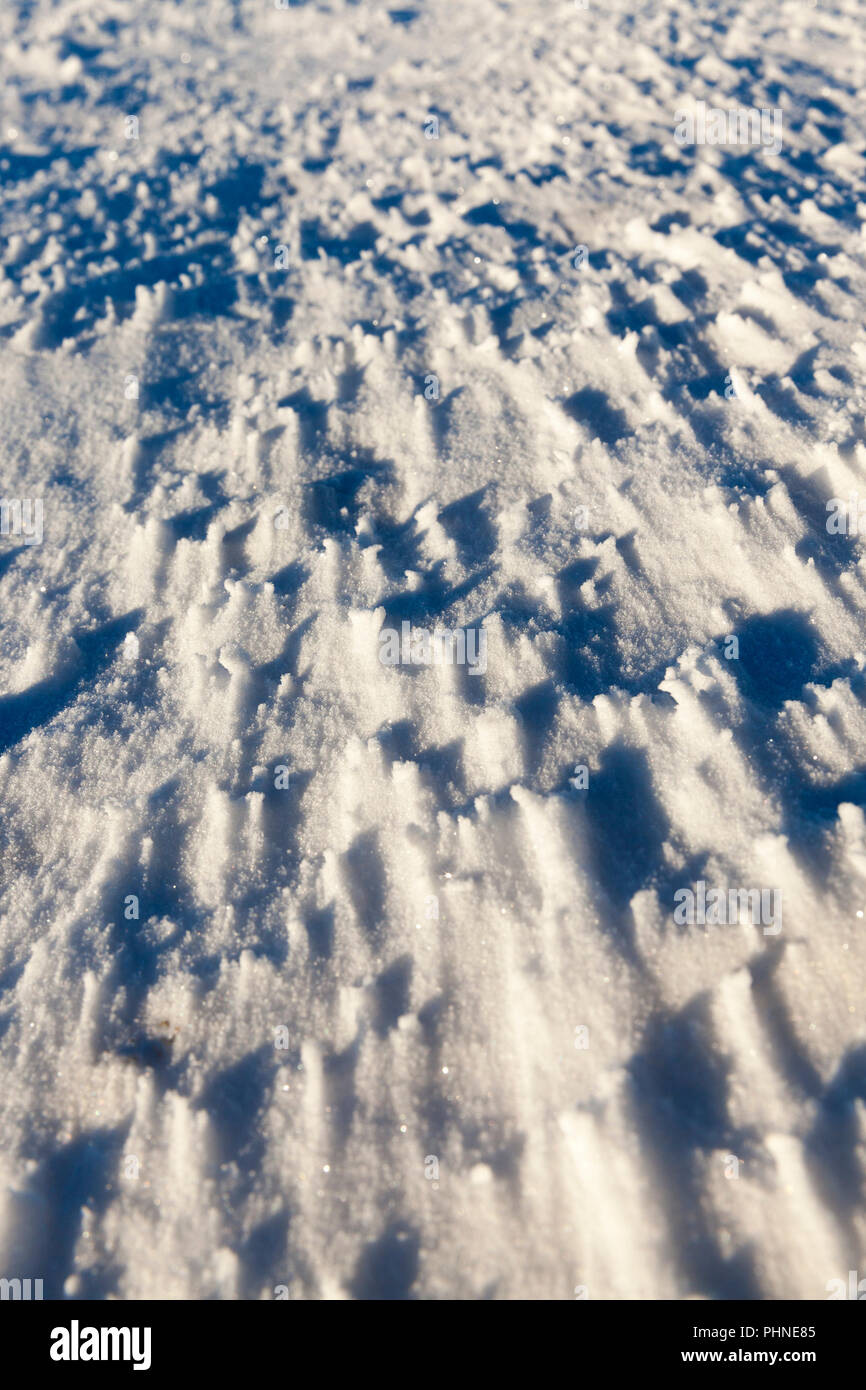 snow covered soil surface is not smooth, Photographed closeup Stock ...