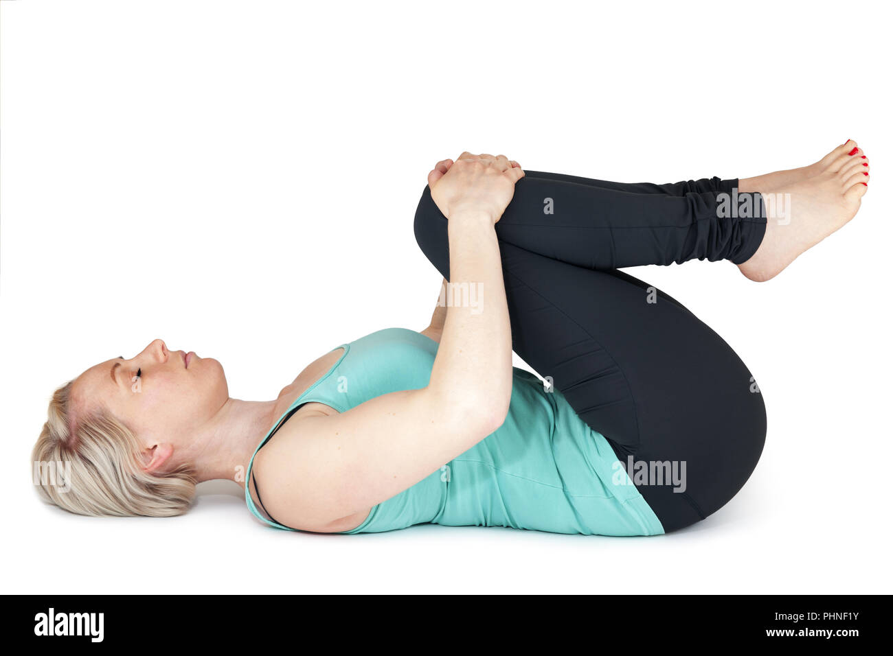 Woman lying on back legs up hi-res stock photography and images - Alamy
