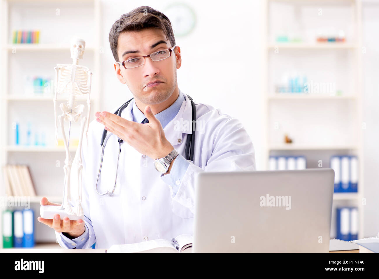 Doctor explaining human body on skeleton Stock Photo - Alamy