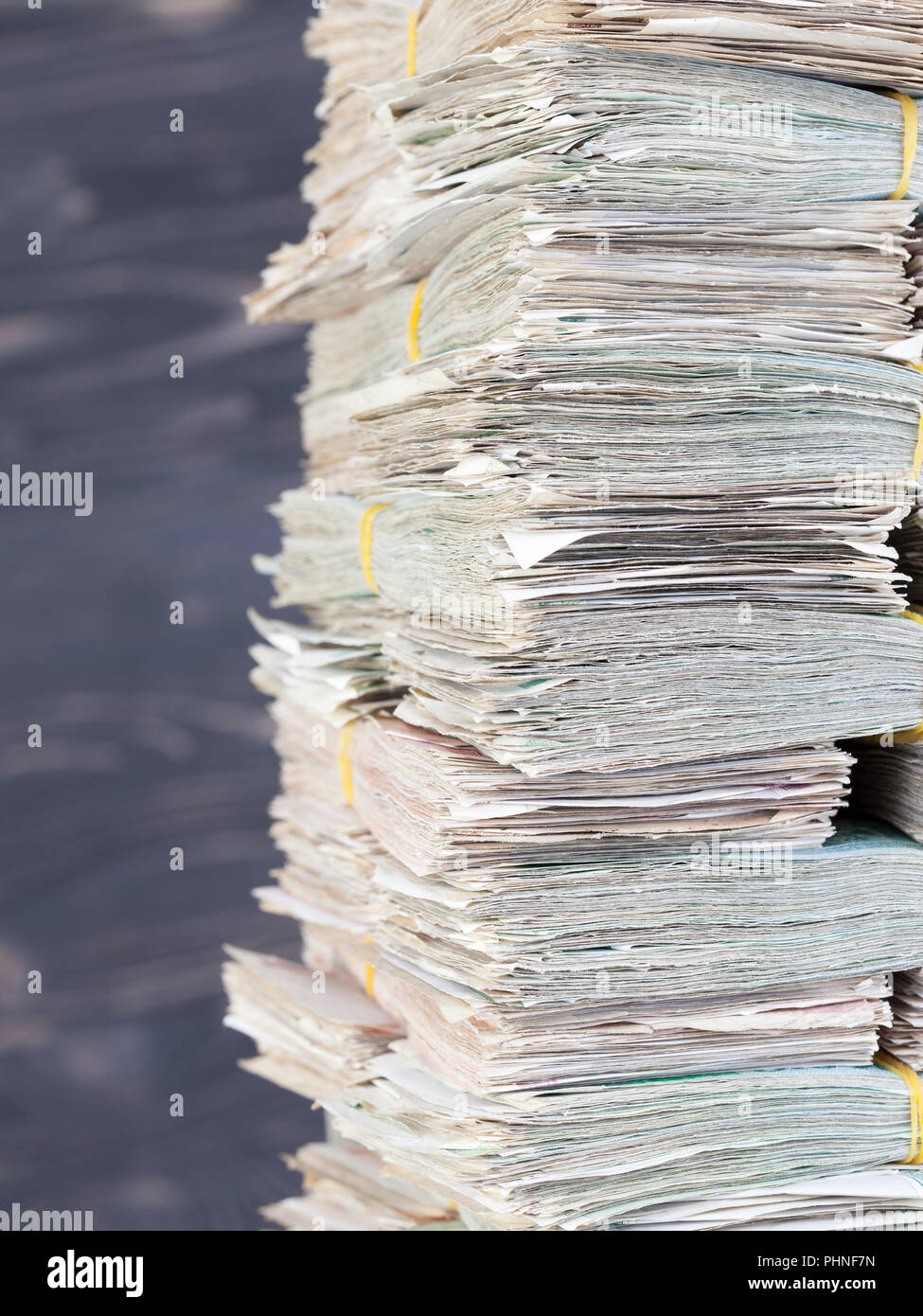 stacks of folded paper money worn and worn out, ready for disposal and ...