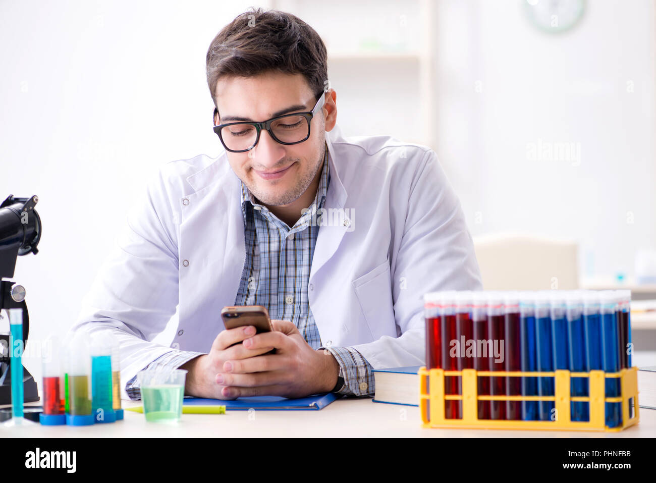 Chemistry student doing chemical experiments at classroom activi Stock ...