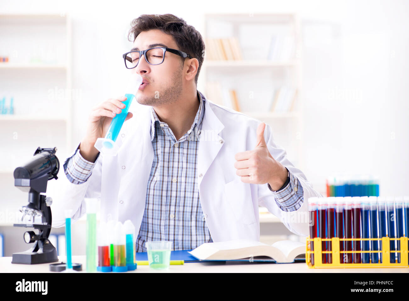 Chemistry student doing chemical experiments at classroom activi Stock ...