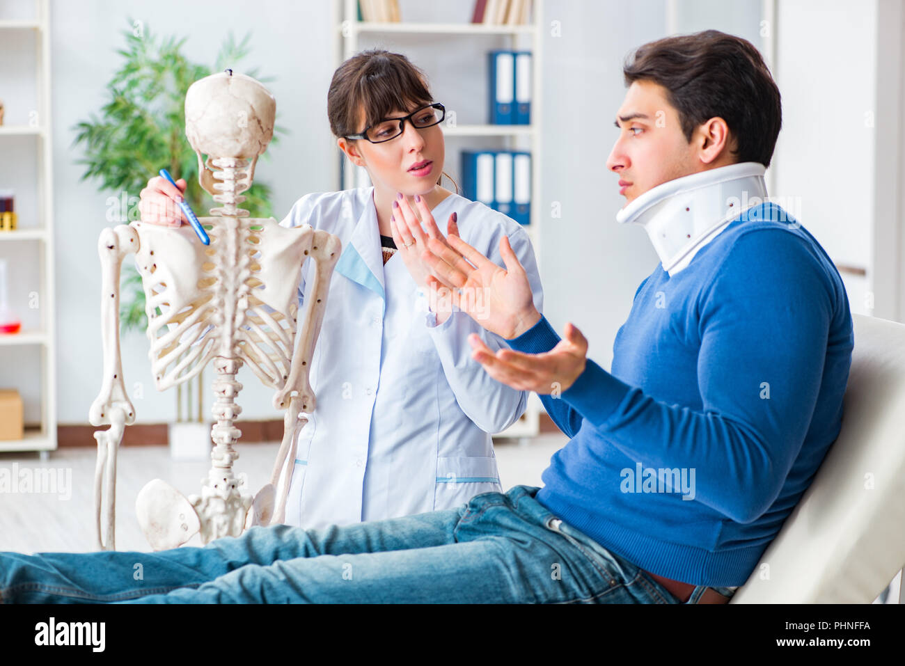 Doctor is explaining to patient with neck injury Stock Photo - Alamy
