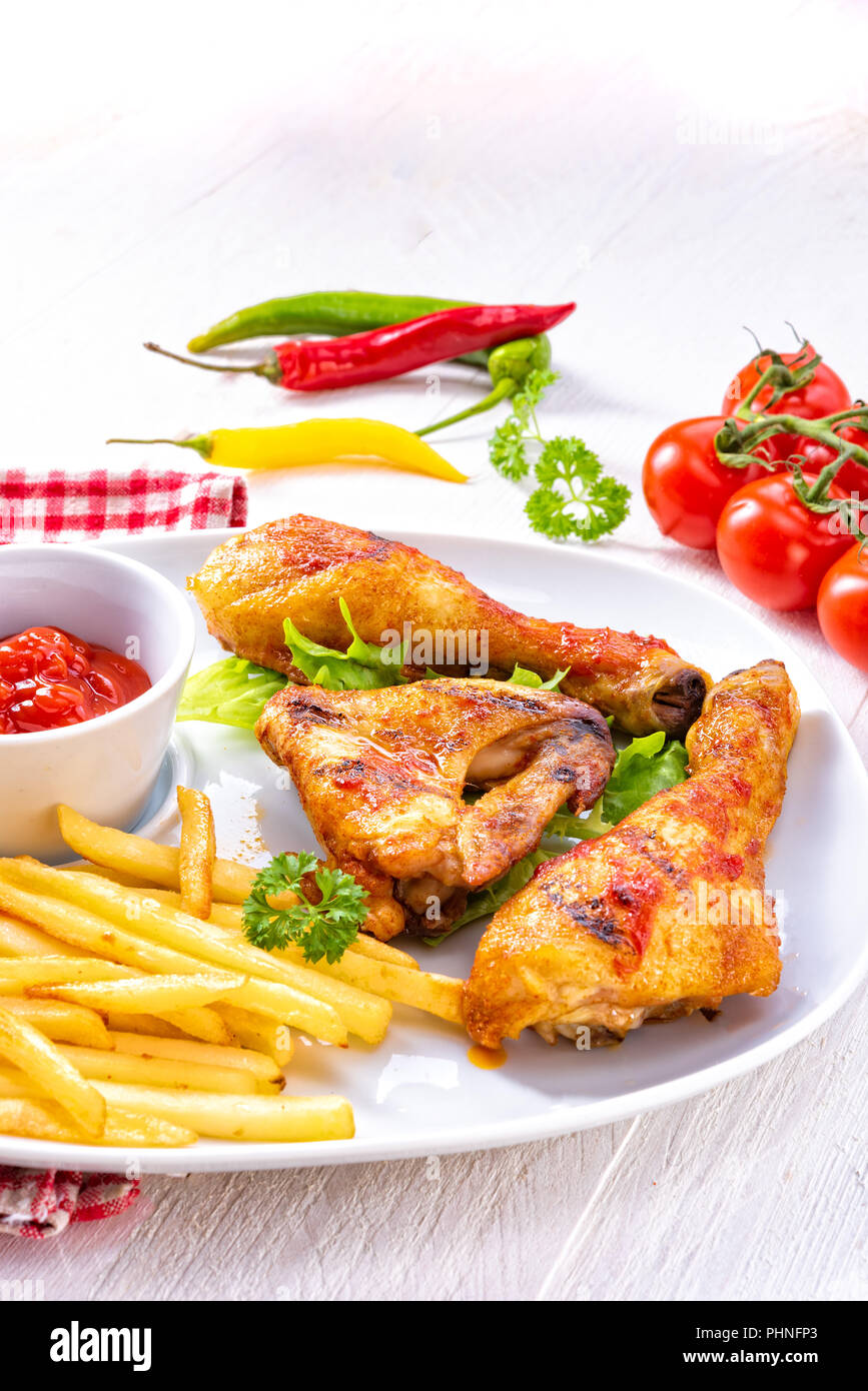 Barbecued chicken leg chips salad hi-res stock photography and images ...