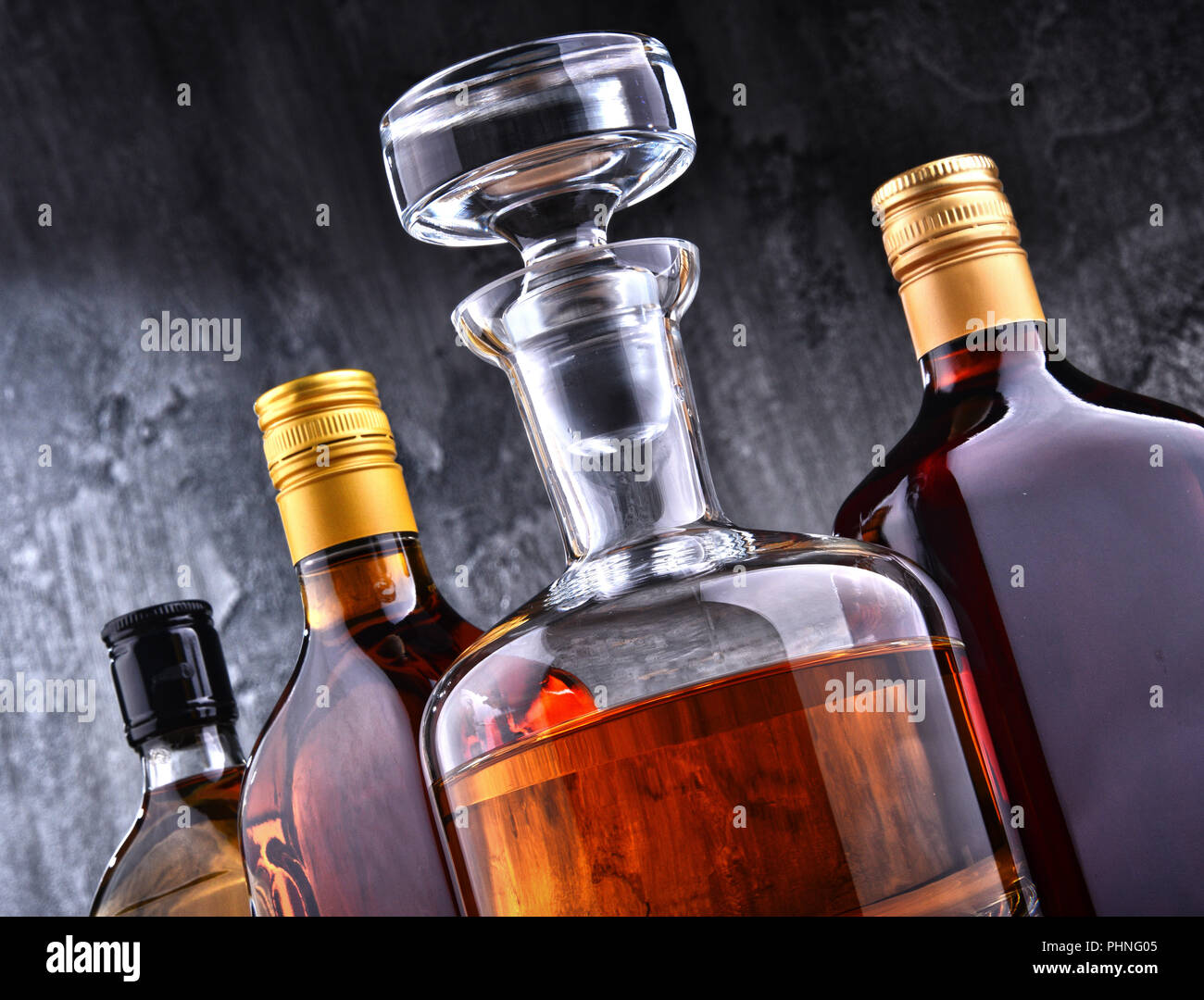 Composition with carafe and bottles of assorted alcoholic beverages ...