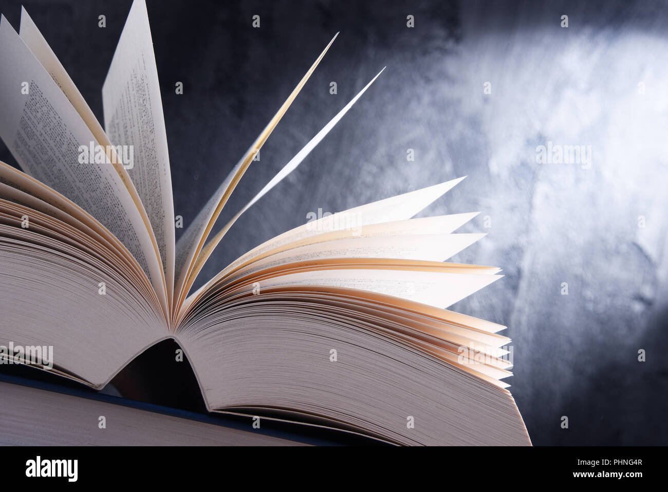 Composition with open book Stock Photo - Alamy