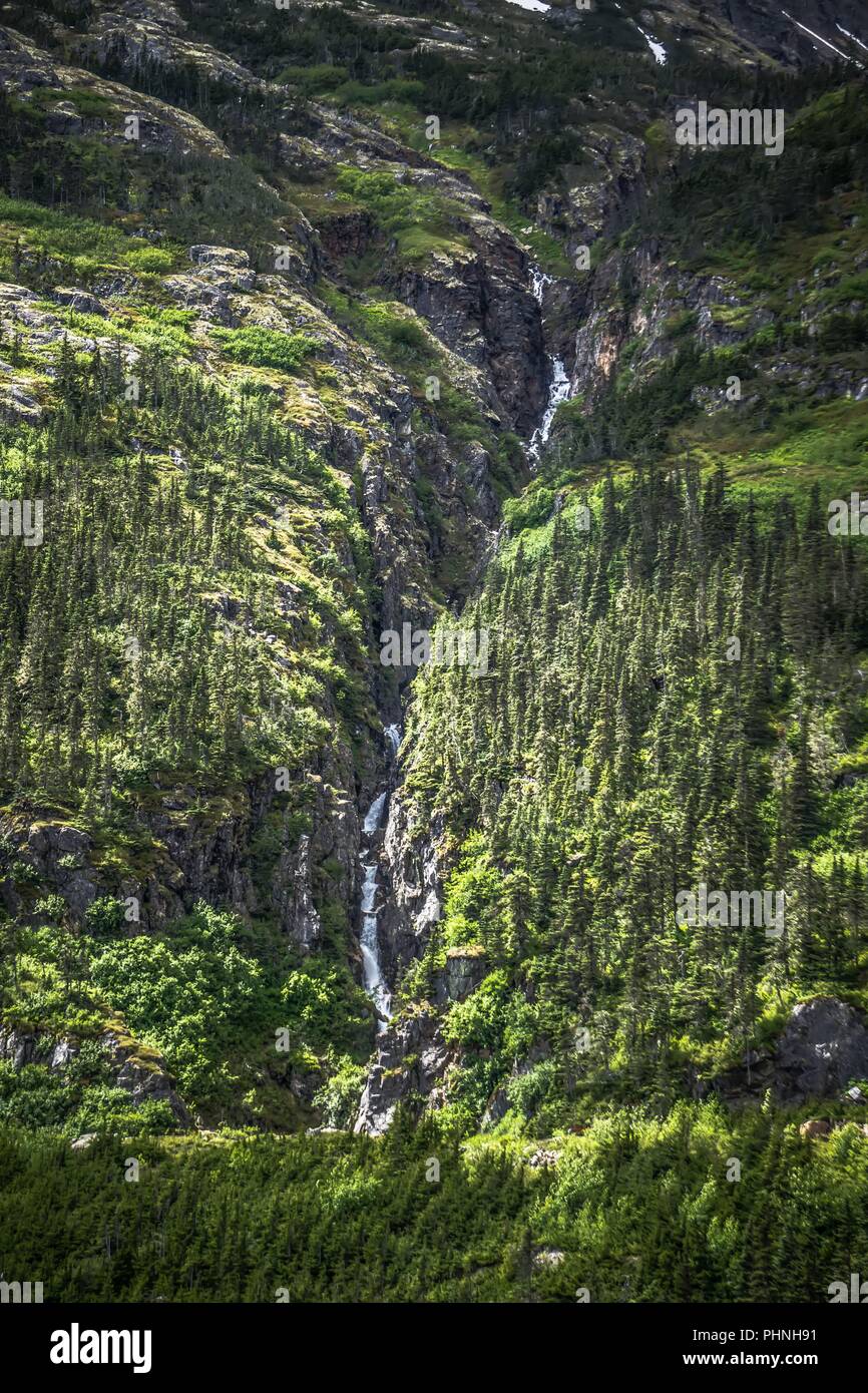 small waterfalls on mountain slopes in alaska mountains Stock Photo - Alamy