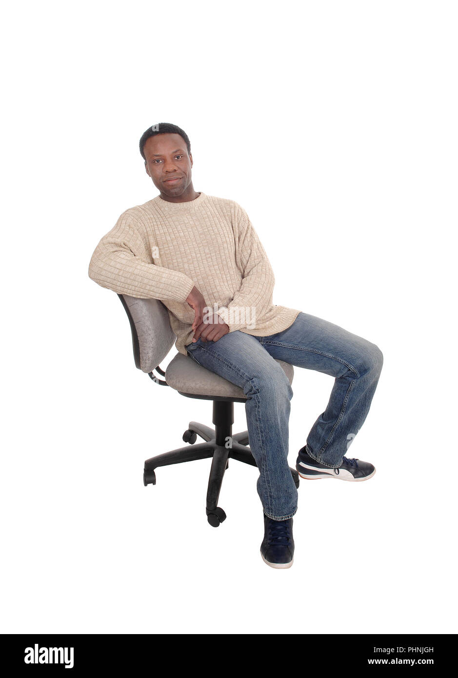 African man sitting on office chair and thinking Stock Photo - Alamy