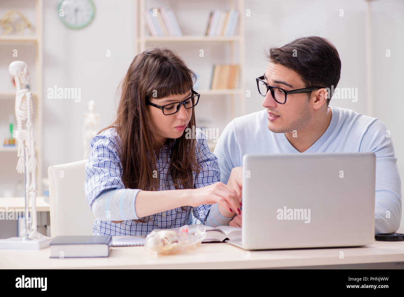 Two medical students studying in classroom Stock Photo - Alamy