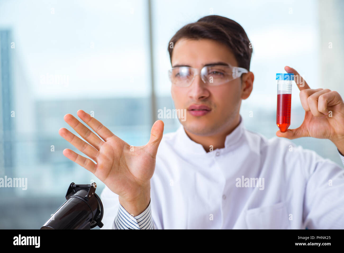 Man doctor checking blood samples in lab Stock Photo - Alamy