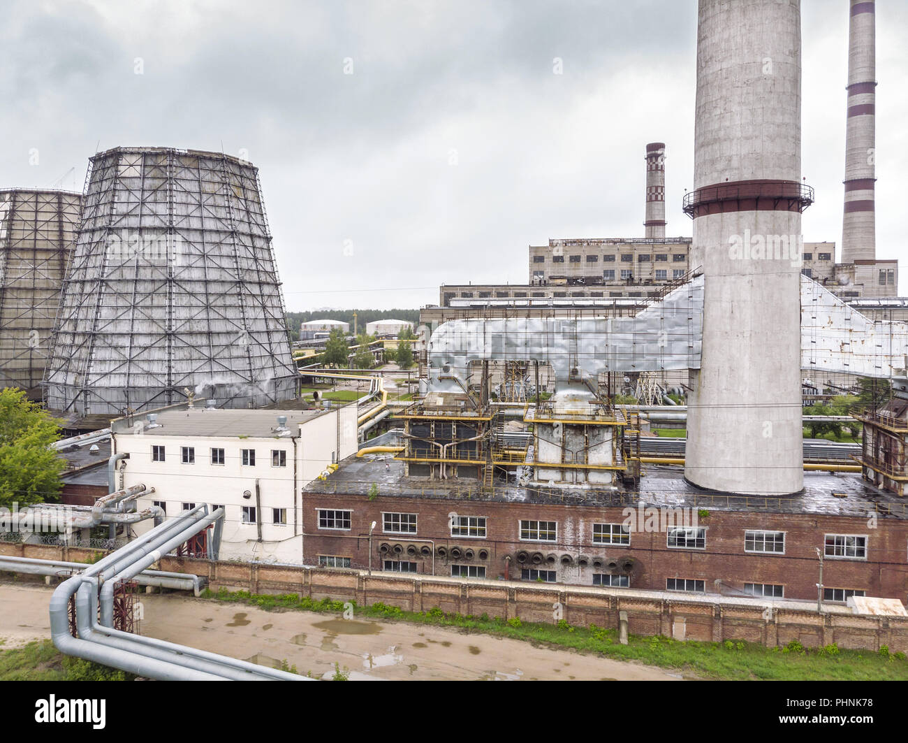 industrial buildings of thermal power station. steam coming from ...