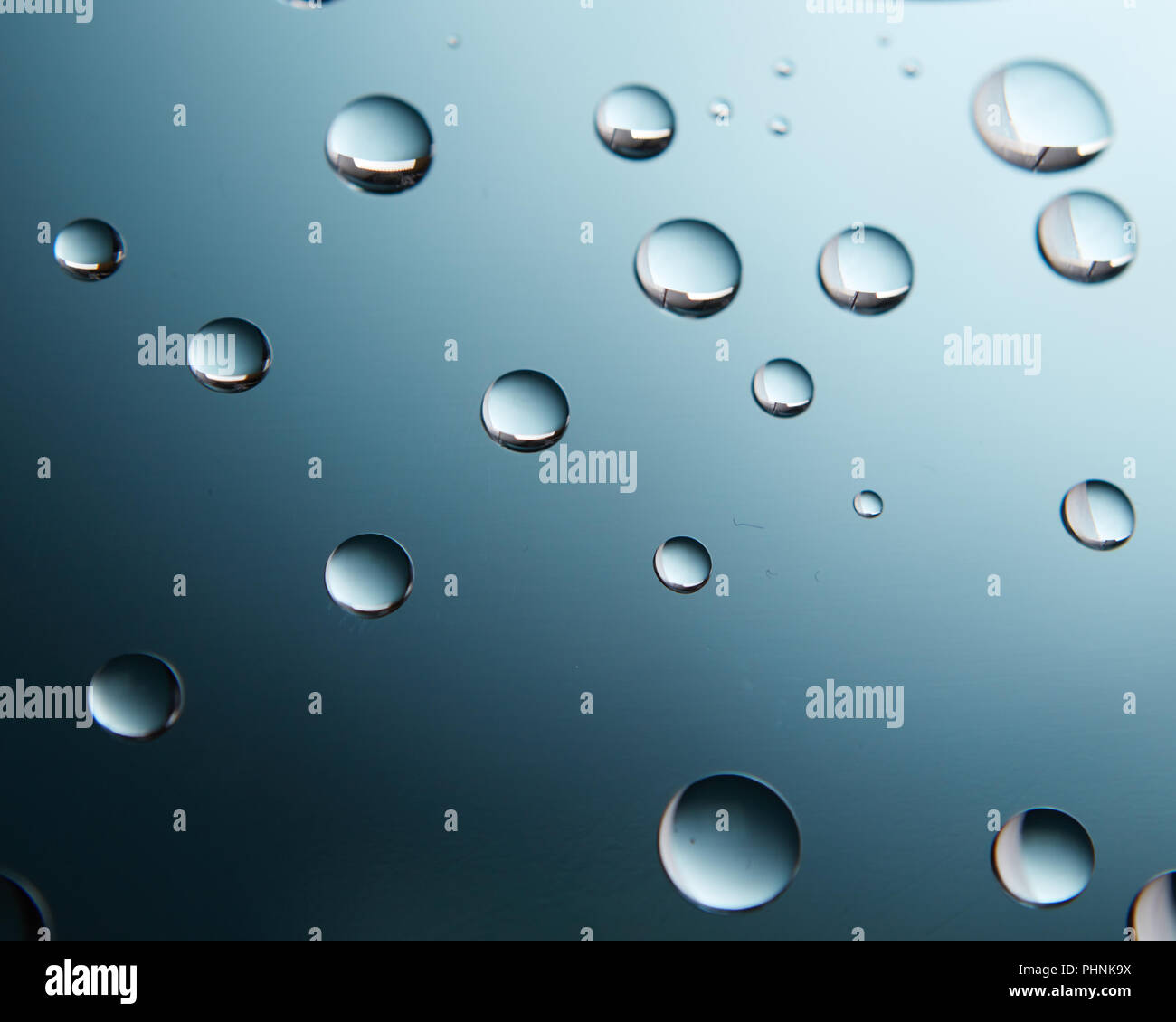 small water drops on the glass on blue gradient background Stock Photo ...