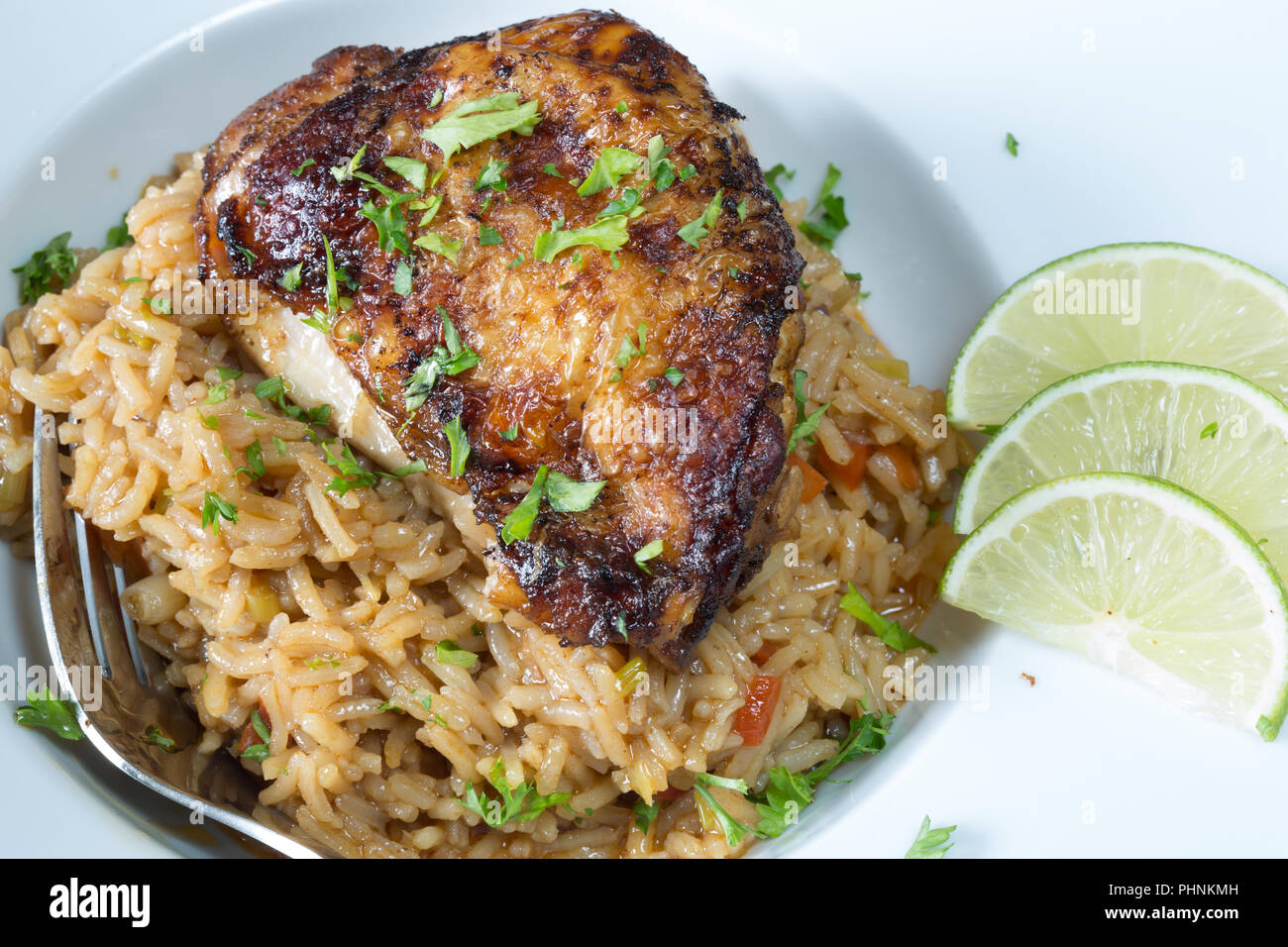 An English pub main course dish of Chili lime Chicken with braised rice ...