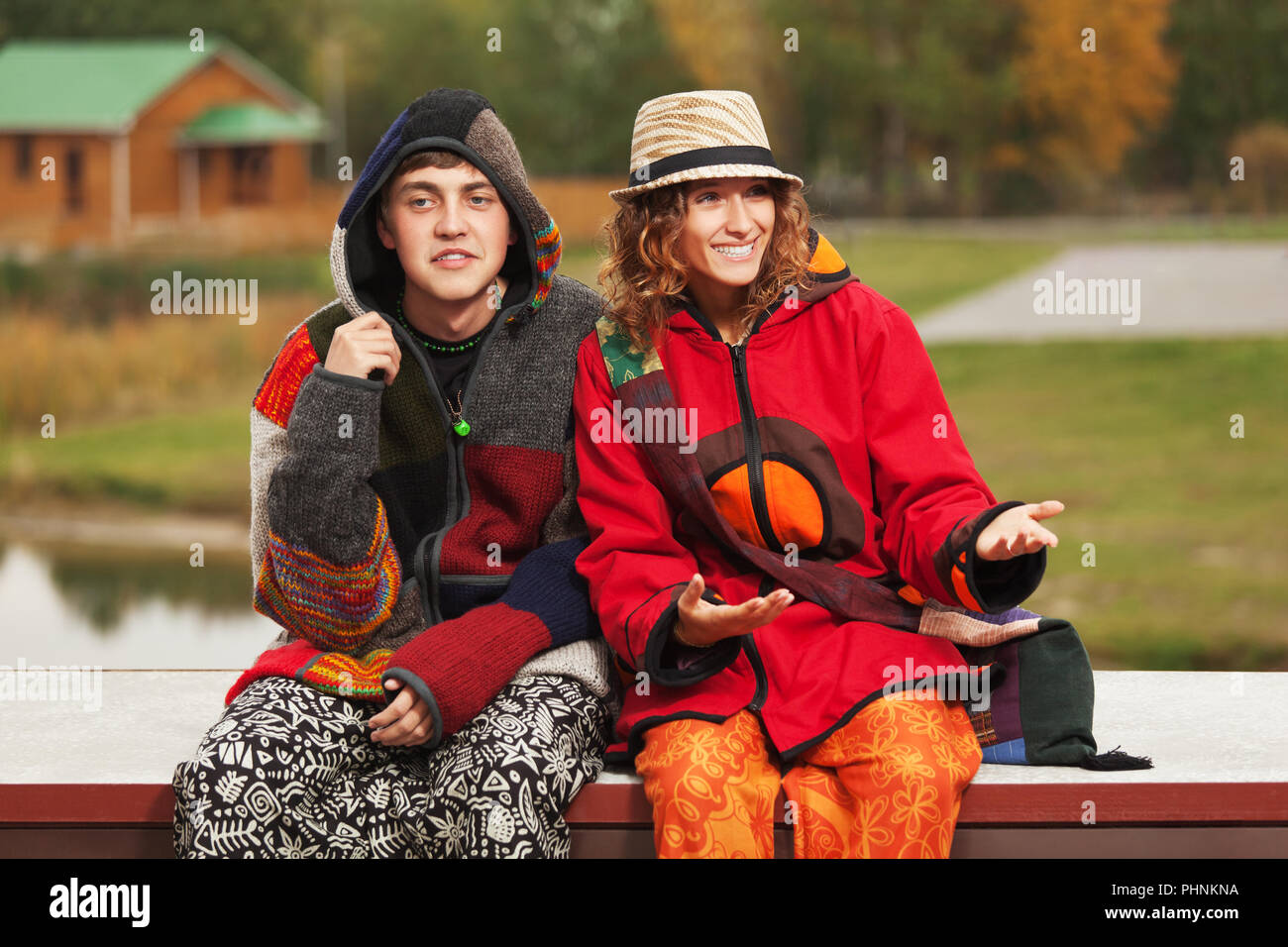 Happy young fashion hippie couple in love outdoor Stock Photo - Alamy
