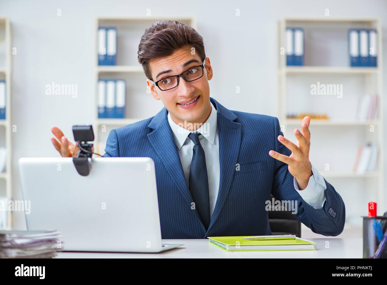 Young help desk operator working in office Stock Photo - Alamy