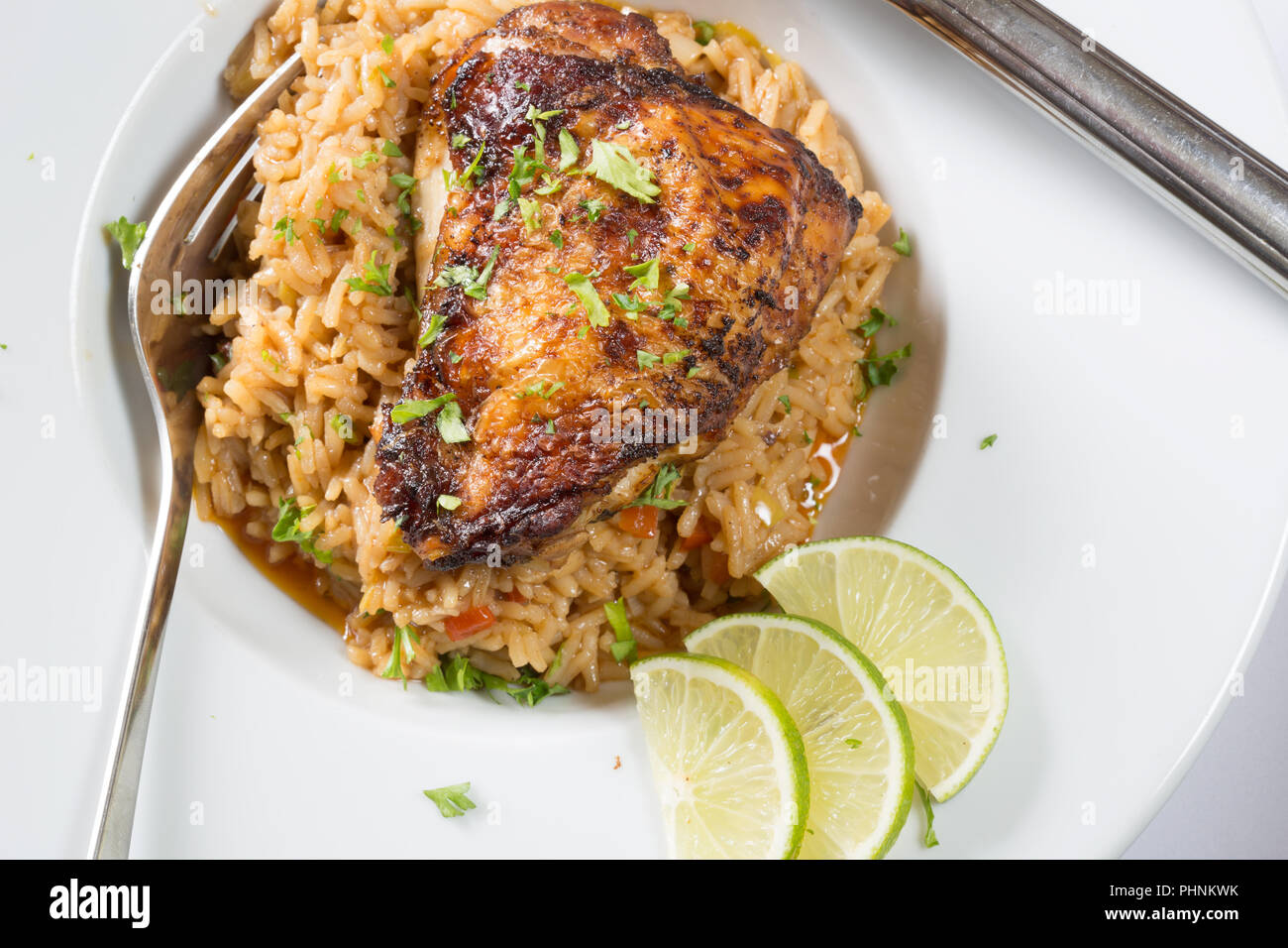An English pub main course dish of Chili lime Chicken with braised rice ...